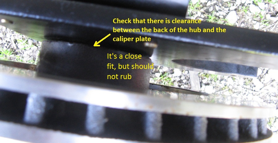 Thread the castle nut onto the spindle and tighten by hand while ...