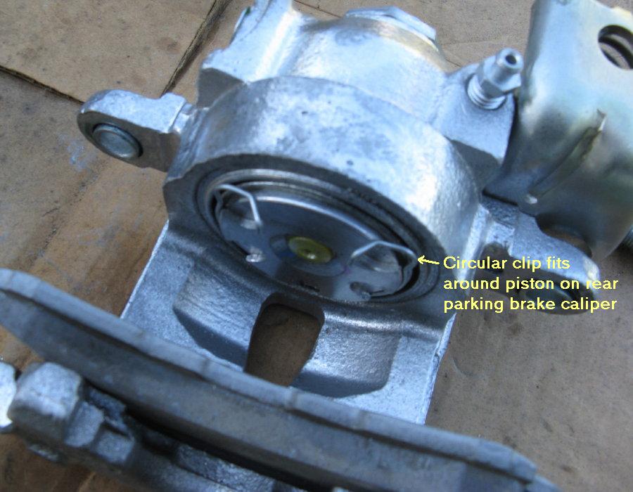 The parking brake calipers are provided with a circular clip that holds ...
