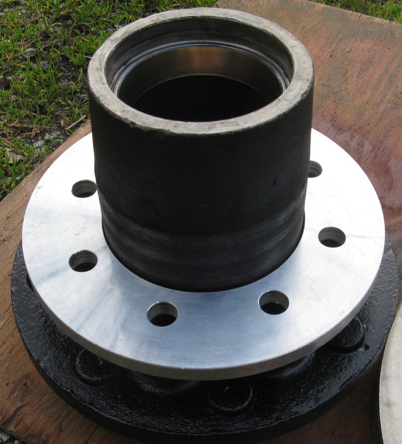 Place the hub so the inner bearing end is facing up. Slide a spacer ...